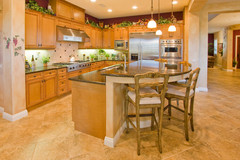 Photo: The kitchen island boasts a sparkling, half moon-shaped Ubatuba ...