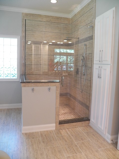 12x24 porcelain tiles laid in a subway pattern in a master shower with ...